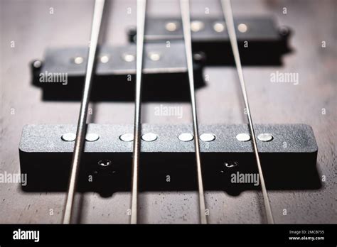 Bass Electric Guitar With Four Strings Closeup Detail Of Popular Rock