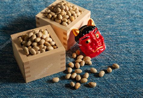 Beans For Bean Throwing And Masks Of Ogres Placed On A Navy Blue