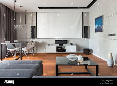 Home Interior With Projector Screen Table Chairs And Cabinet Stock