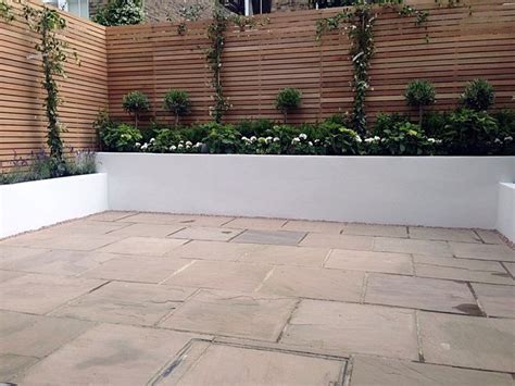 Low White Rendered Wall With Horizontal Wooden Wall Above It Clean Crisp Finish Softened By
