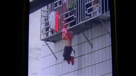 Video Men Save Girl Dangling From Fourth Storey Window In China