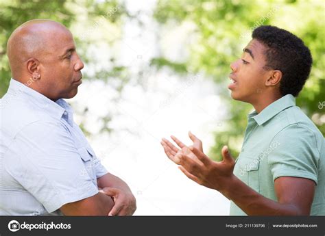 Father And Son Having A Serious Conversation Stock Photo By