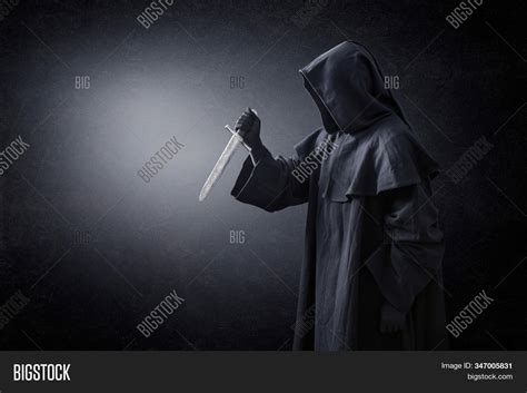 Hooded Man With Knife