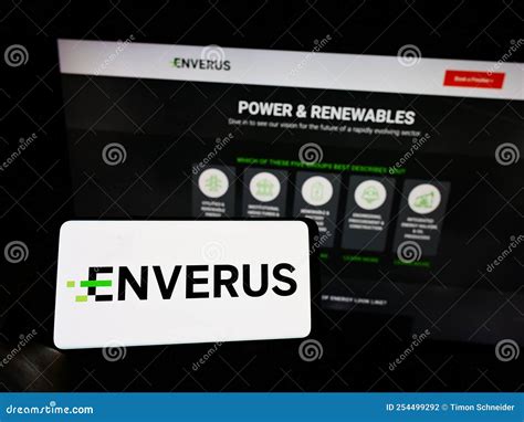 Person Holding Cellphone With Logo Of American Software Company