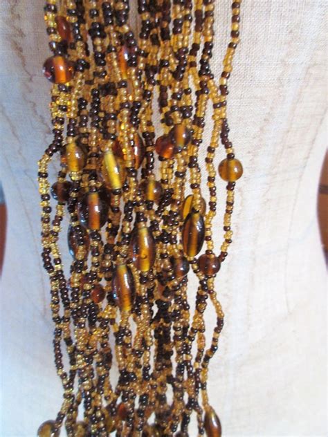 Multi Strand Glass Seed Bead Necklace With Very Long Gem
