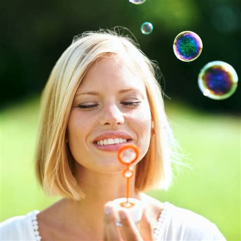 Happy Woman Nature And Blowing Bubbles With Smile For Fun Day In Sunshine At Outdoor Park Face