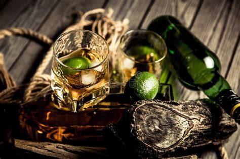 Glass Of Whiskey A Glass Of Rum On A Wooden Bar Counter Stock Image