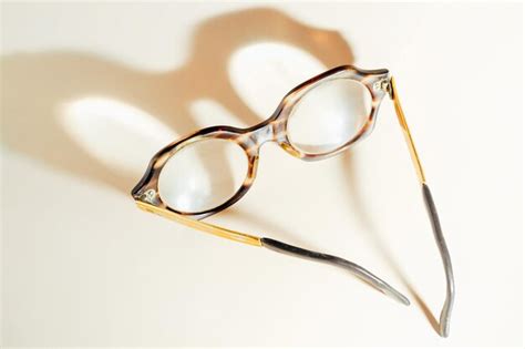 Premium Photo Glasses For Old People Lie On Beige Background And Cast