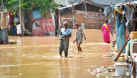 See Pics Yamuna Flows Above Danger Mark In Delhi