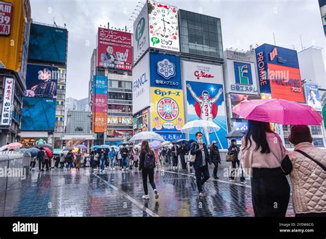 Famous Dotonbori Glico Sign Large Vibrant Advertisement On A Rainy Day