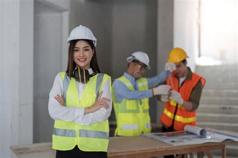 Portrait Construction Worker And Building With A Woman Engineer