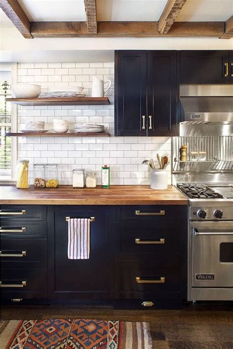 Black Cabinets Gold Hardware With Rustic Beams And Counters Butcher
