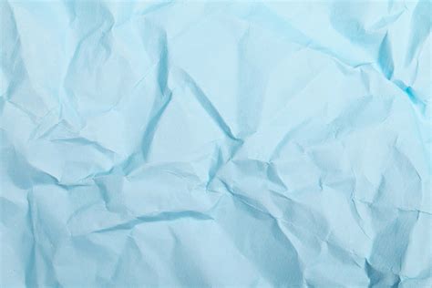 Download A Blue Paper With Crumpled Edges