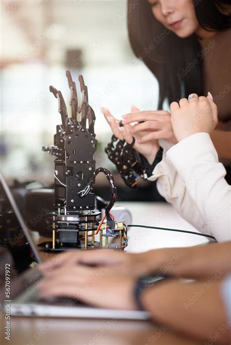 Diverse People University Babe Studying Robotic Arm Programming Coding On Graduate Project