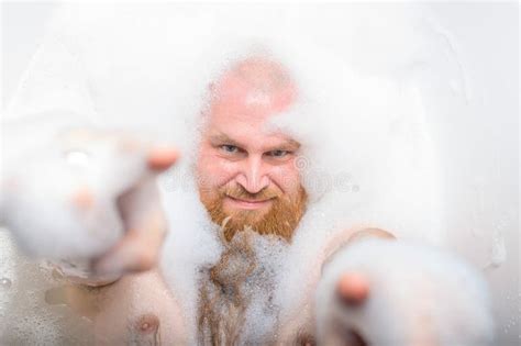 Close Up Portrait Of Funny Red Bearded Bald Man Taking A Bath With Foam