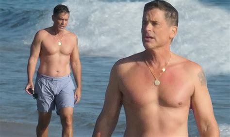 Rob Lowe 56 Bares His Muscles As He Goes Shirtless For A Walk On The Beach In Santa Barbara