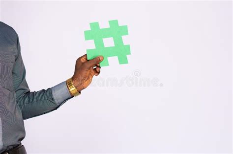 Businessman Holding A Hash Tag Symbol Stock Photo Image Of Hash