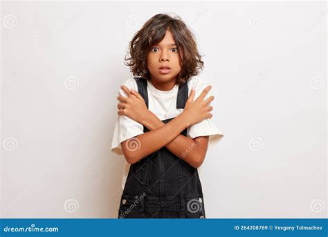 Stupefy Brunette Young Guy In Denim Overalls Keeps Arms Crossed Feels
