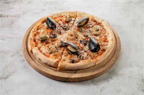 Premium Photo Tasty Pizza With A Seafood Squids And Mussels On The