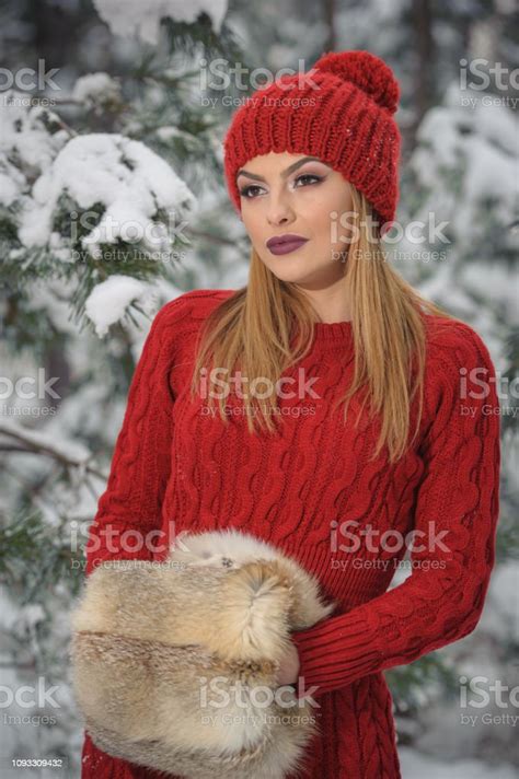 Beautiful Woman In Red With Brown Fur Cape Enjoying The Winter Scenery In Forest Blonde Girl