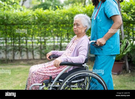 Doctor Caregiver Help And Care Asian Senior Or Elderly Old Lady Woman