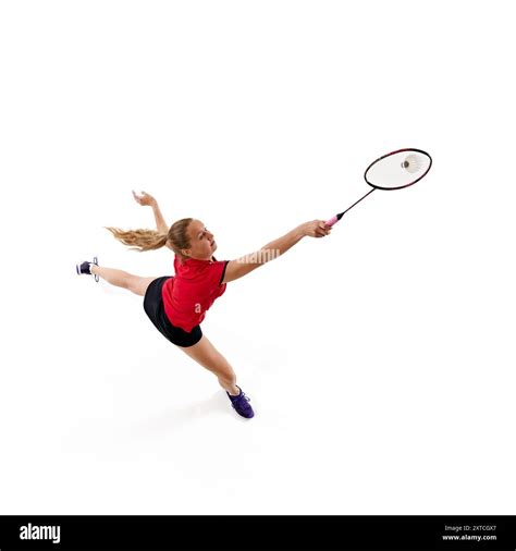 Aerial View Of Female Badminton Player Jumping In Motion To Hit
