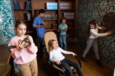 Interested Tweens Trying To Get Out Of Escape Room Stock Photo Image