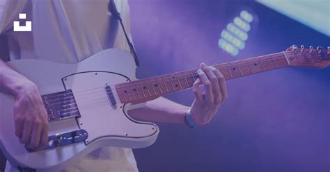 Man In White Dress Shirt Playing White Electric Guitar Photo Free