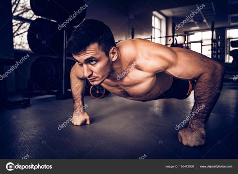 Fitness Man Performs Push Ups With Naked Torso Stock Photo By Yakov