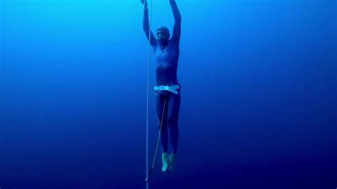 Diving Deep Underwater Barefaced In Tight Wetsuit