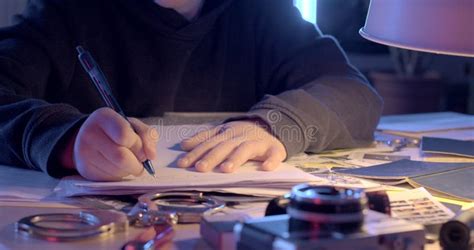 teenager s hands write text on paper at the table stock video video