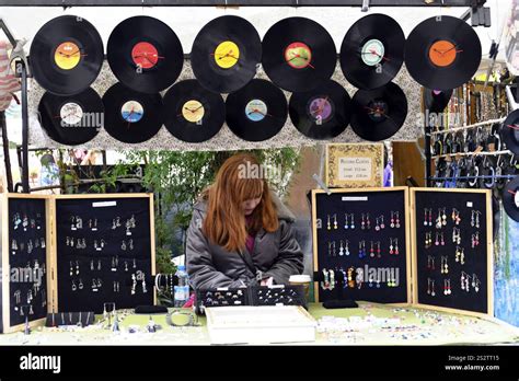 Market Stall With Handmade Jewellery In Front Of A Wall Of Records