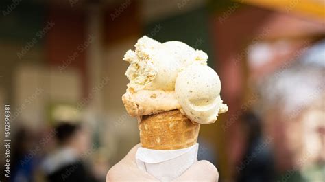 Hand Holding Homemade Pistachio And Salted Caramel Gelati Ice Cream In
