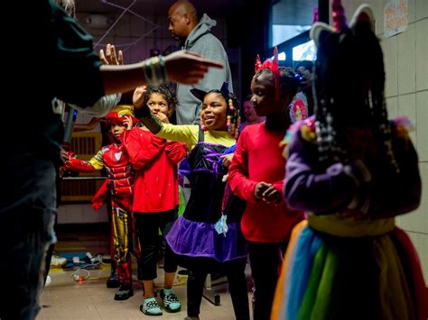 Flint Students Show Off Costumes Receive 200 Halloween Gift Bags At