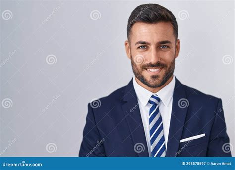 Handsome Hispanic Man Wearing Suit And Tie With Hands Together And