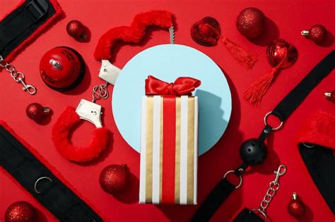 Sex Toy With New Years Decor On A Red Background Premium Ai