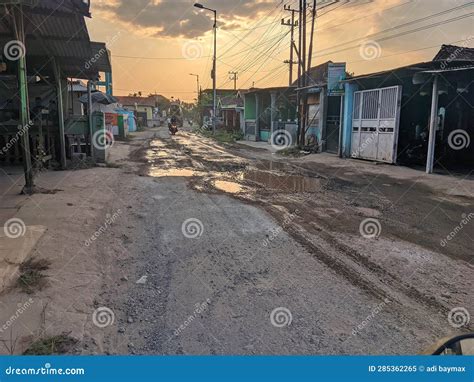 The Roads In The Village Are Full Of Potholes That Are Flooded With