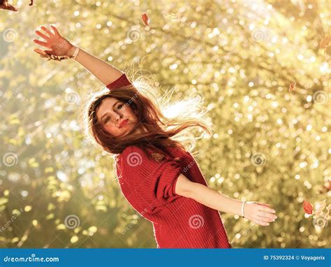 Woman Relaxing In Autumn Park Throwing Leaves Up In The Air Stock Photo Image Of Outside