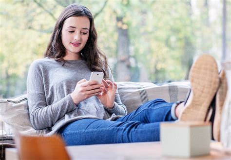 Young Woman With Cell Phone By Stocksy Contributor W2 Photography