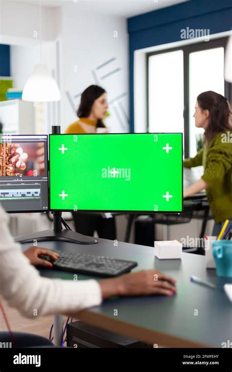 Black Videographer Performing At Pc With Chroma Key Mock Up Isolated Display Editing Video