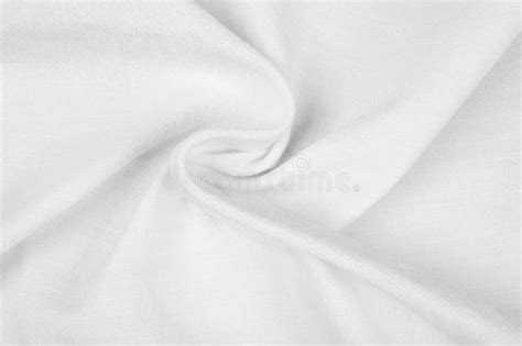 White Fabric Texture Close Up Of A Piece Of Crushed And Twisted White