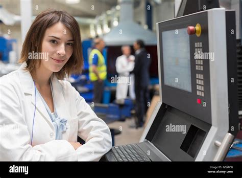 Portrait Smiling Female Engineer At Control Panel In Steel Factory Stock Photo Alamy