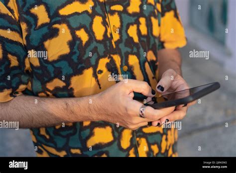 Close Up Of An Anonymous Man With Painted Fingernails Sending A Message