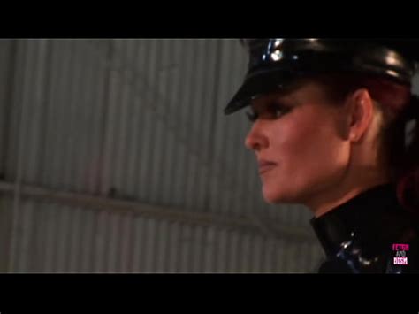 A Seductive Law Enforcement Officer Clad In A Latex Costume Engages In Intimate Relations With