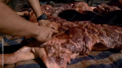4k Men Cuts Skin Pork Carcass In A Slaughter On The Street Road At