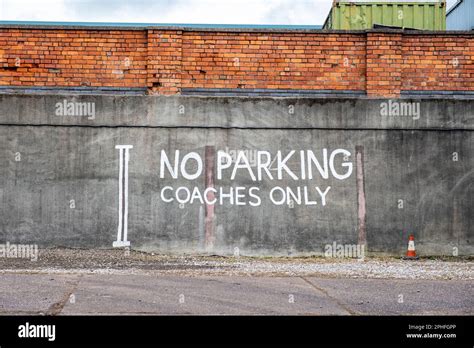 No Parking Coaches Only Traffic Warning Sign Painted On Concrete Wall