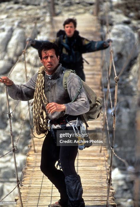 Sylvester Stallone And Janine Turner Walking On A Shakey Wooden News