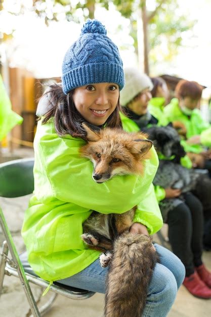Premium Photo Woman Hug Fox