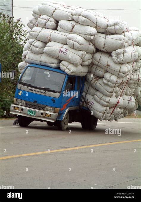 Heavy Load A Truck Carrying A Massive Load Of Heavy Goods Nearly