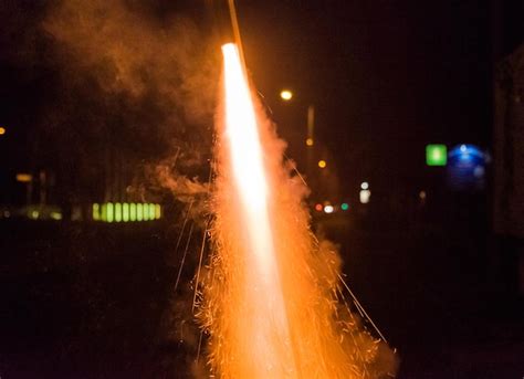 Premium Photo Fire Cracker Burning On Street At Night